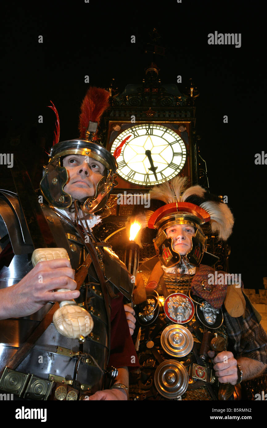 City of Chester, England. Roman Tours conducting a torchlight Christmas ...