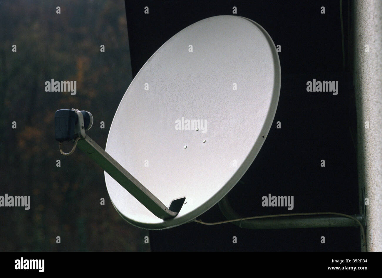 Small satellite aerial on the house wall Stock Photo - Alamy