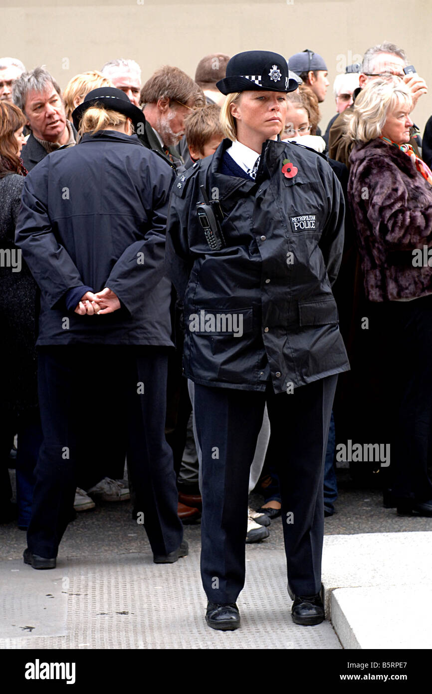 A sad looking female Police officer on duty at the Cenotaph in London ...