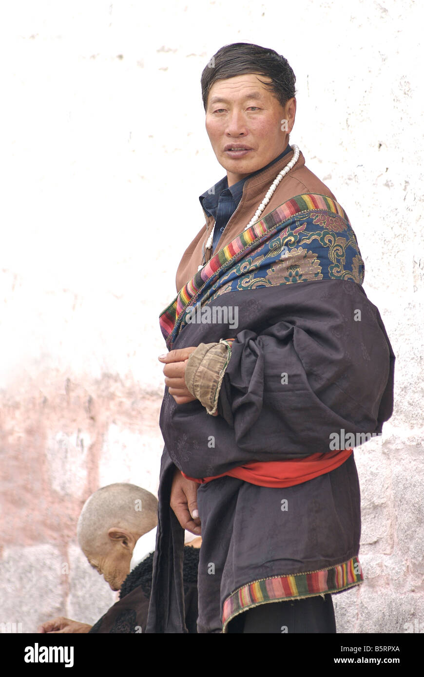 Tibetan man in tradiional attire. Lhasa, Tibet Stock Photo - Alamy
