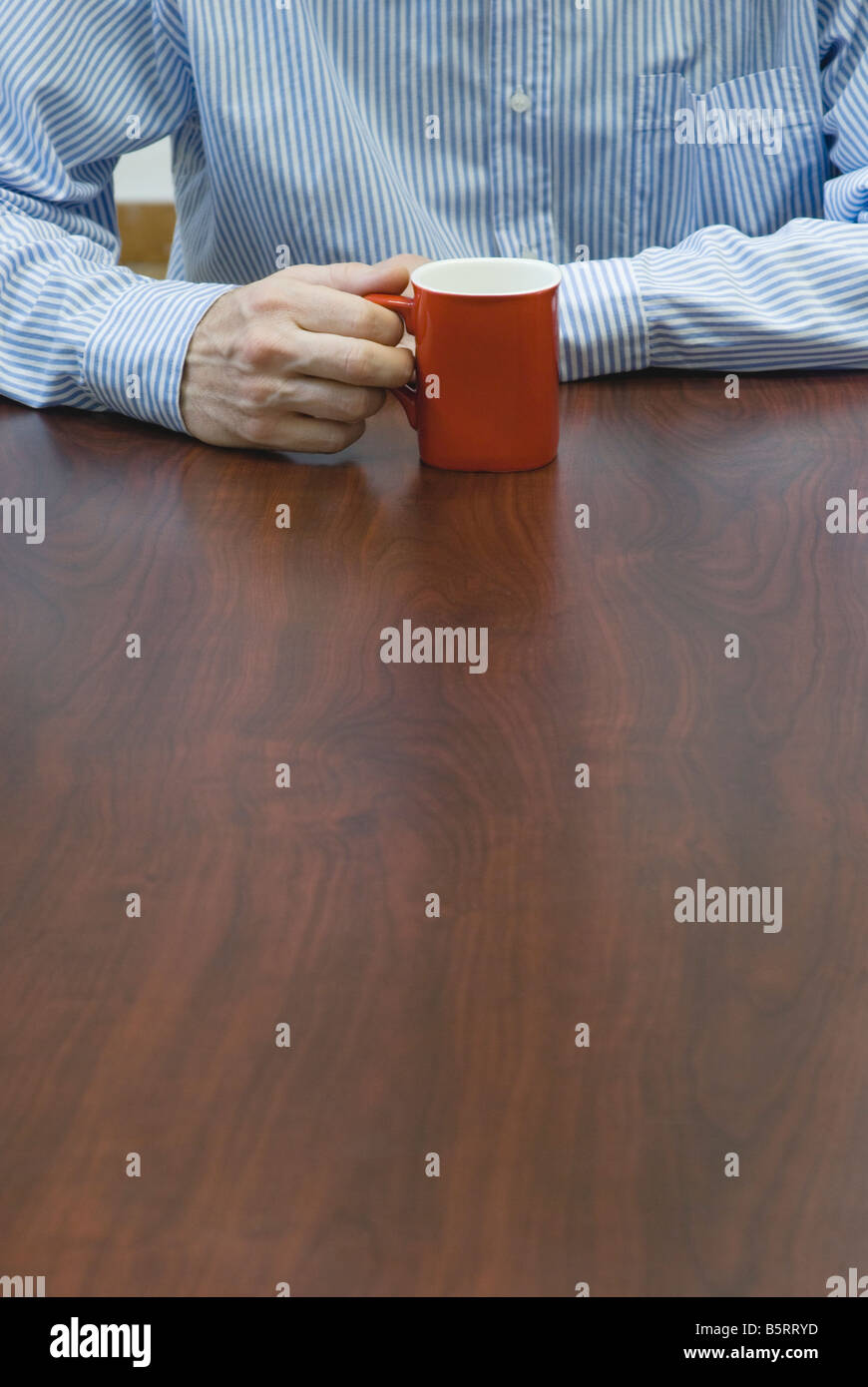 office worker at desk with coffee mug Stock Photo - Alamy