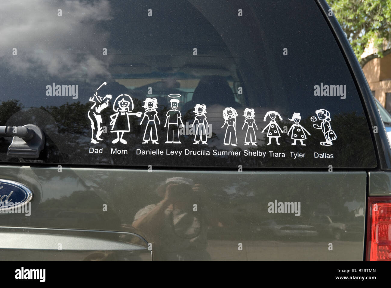 line up of family members stickers on rear vehicle windshield Stock ...