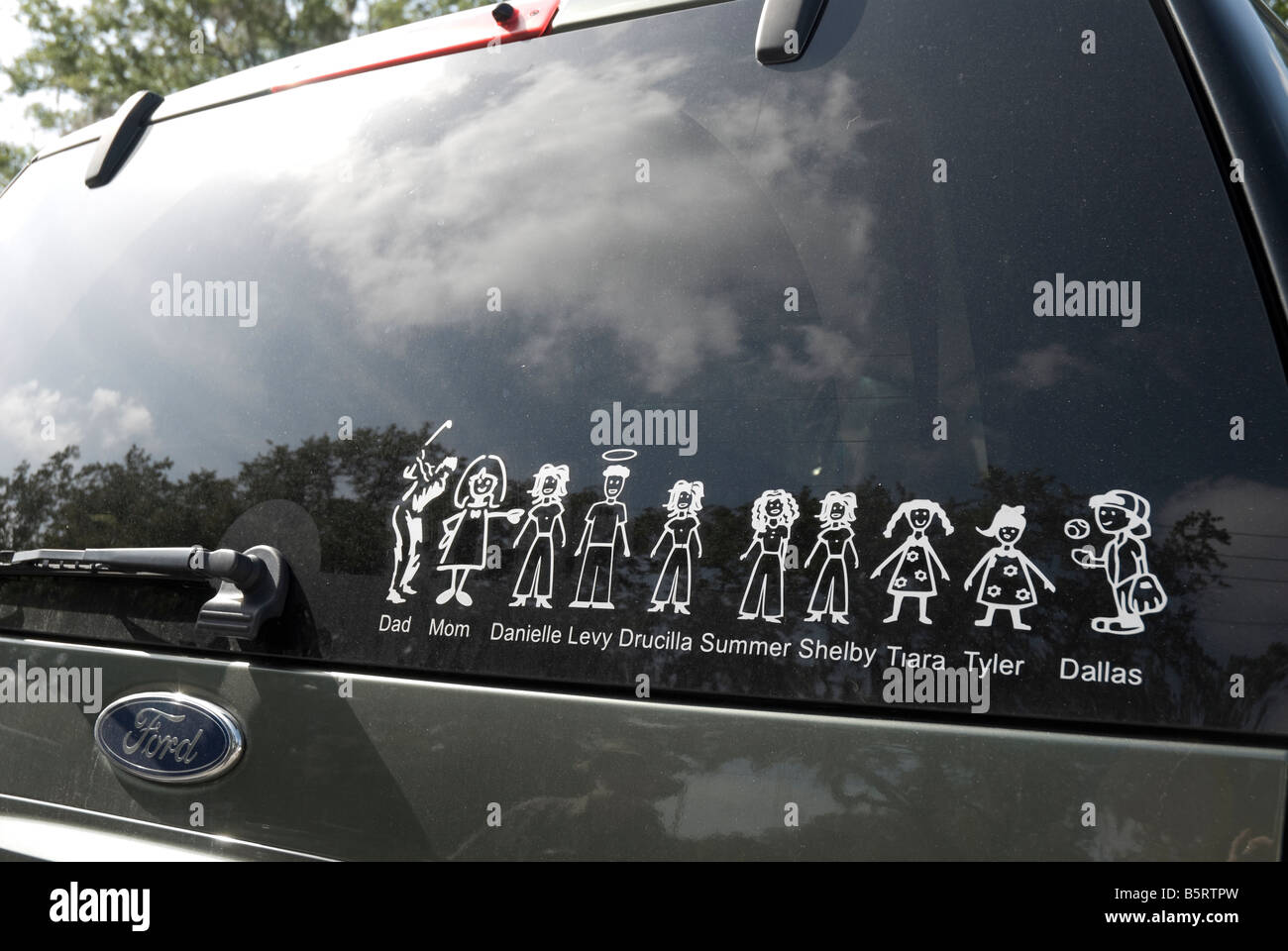 line up of family members stickers on rear of vehicle Stock Photo - Alamy
