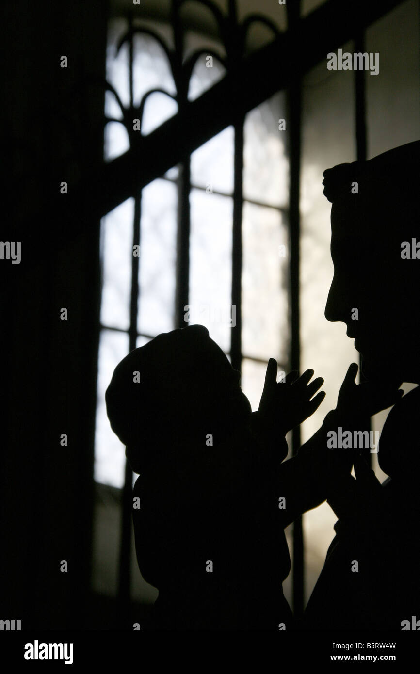 baby jesus and man shadow silhouette in church in rome Stock Photo - Alamy