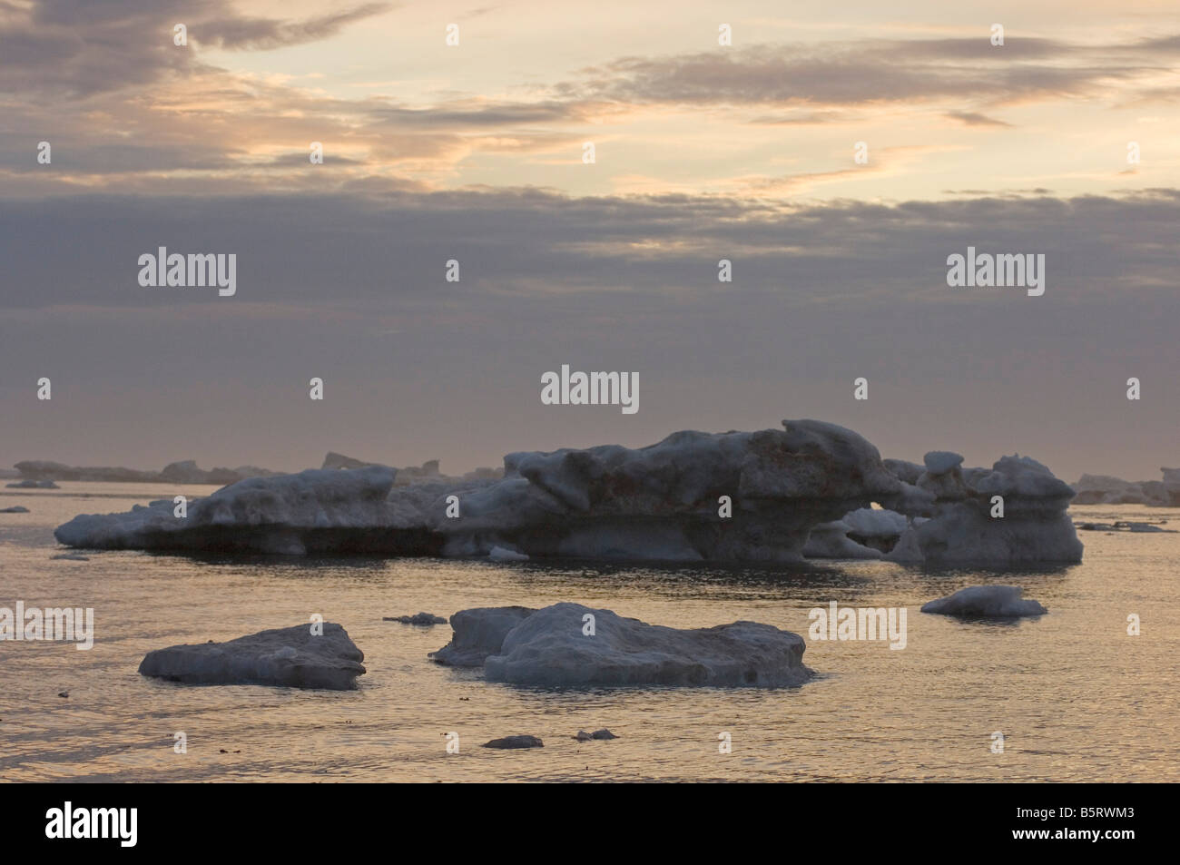 melting shorefast ice in the Beaufort Sea at sunset Arctic Ocean off ...