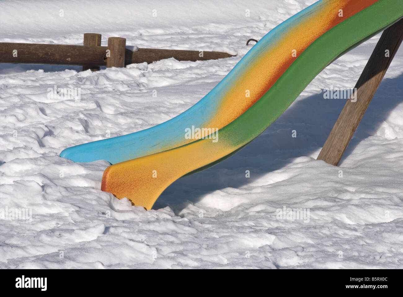 slide in playground under the snow Stock Photo - Alamy