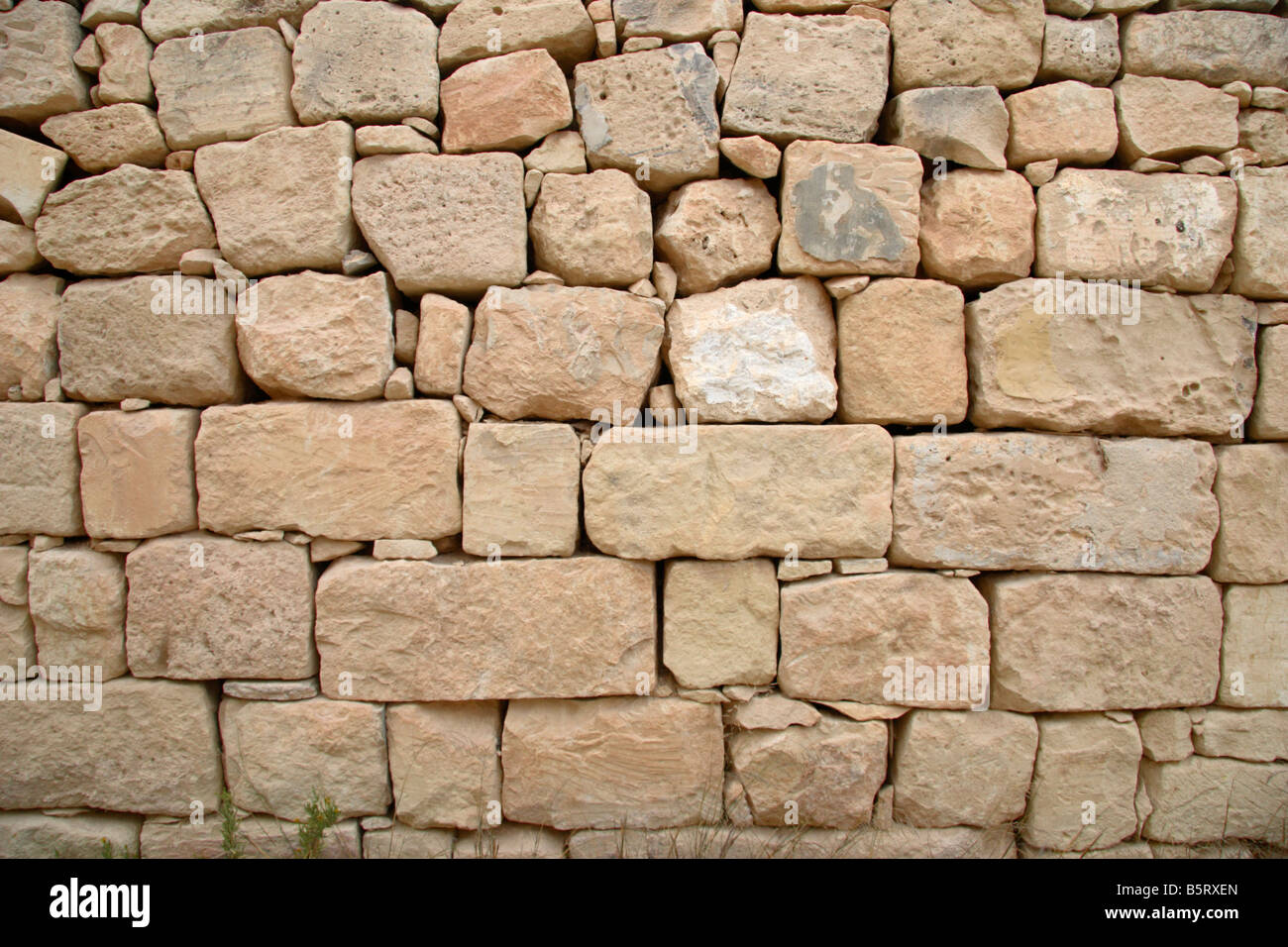 A Limestone, drystone wall in "St Thomas Bay" Malta Stock Photo - Alamy
