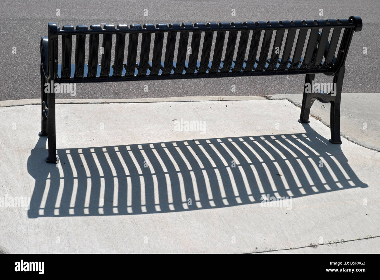 metal bench and its shadow in new shopping center North Florida Stock ...