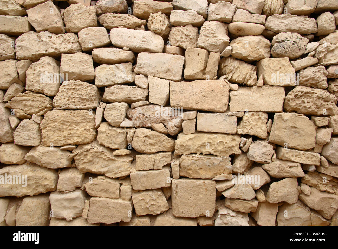 A Limestone, drystone wall in "St Thomas Bay", Malta Stock Photo - Alamy