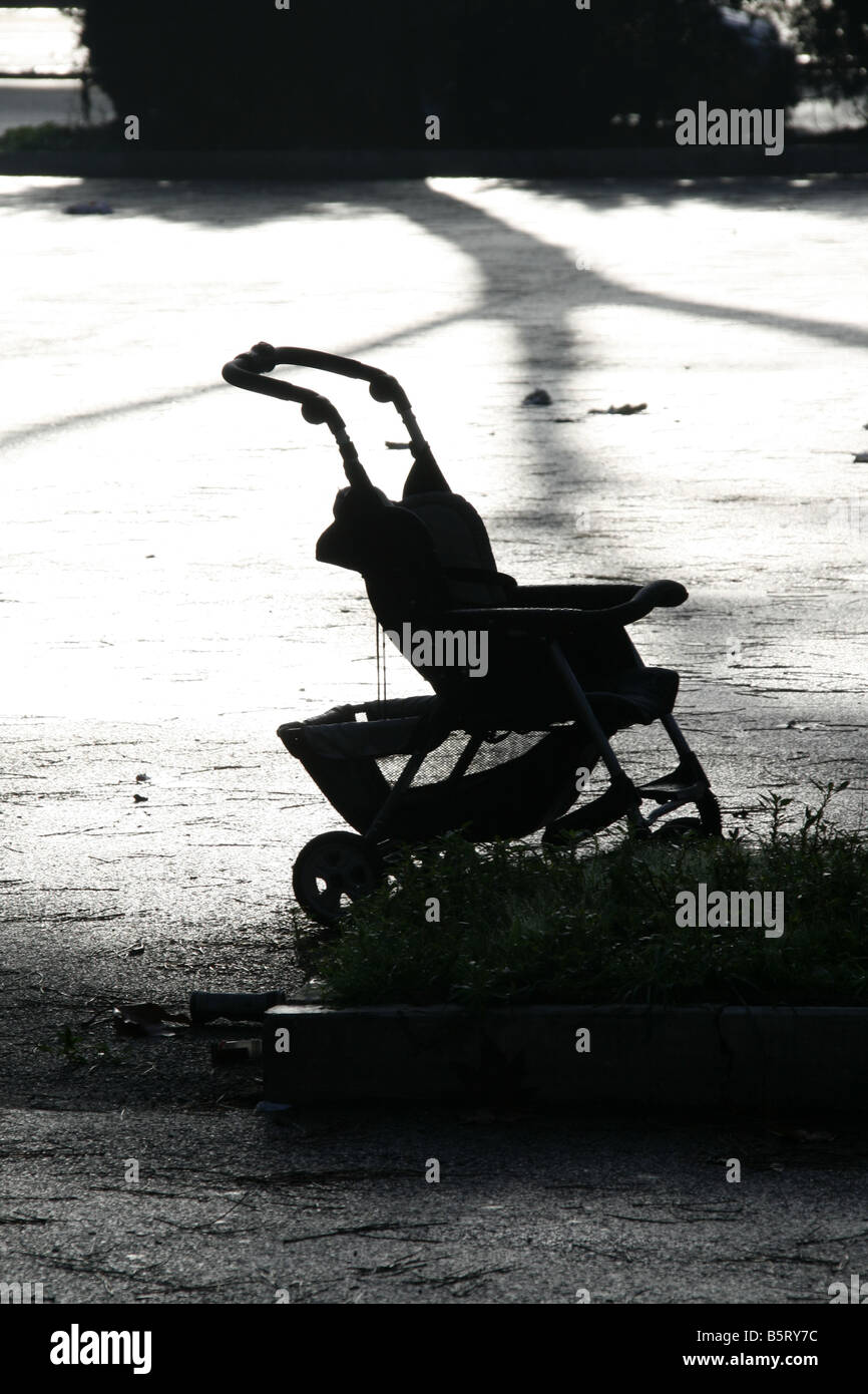 one empty baby pram carrier in car park in town Stock Photo - Alamy