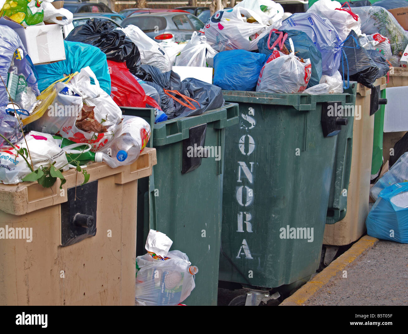 Overflowing rubish bins Stock Photo - Alamy