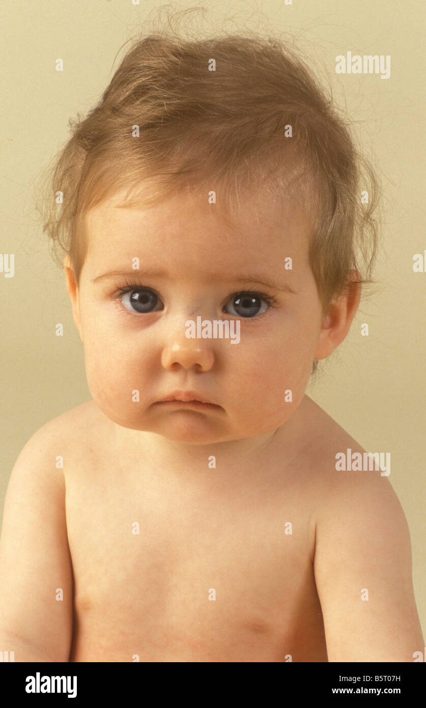 glum looking baby Stock Photo - Alamy