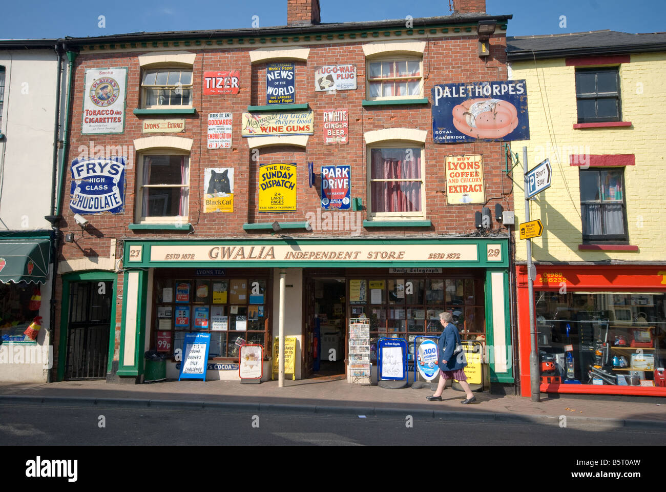 Hardware shop or independent store with old advertisement signs ...