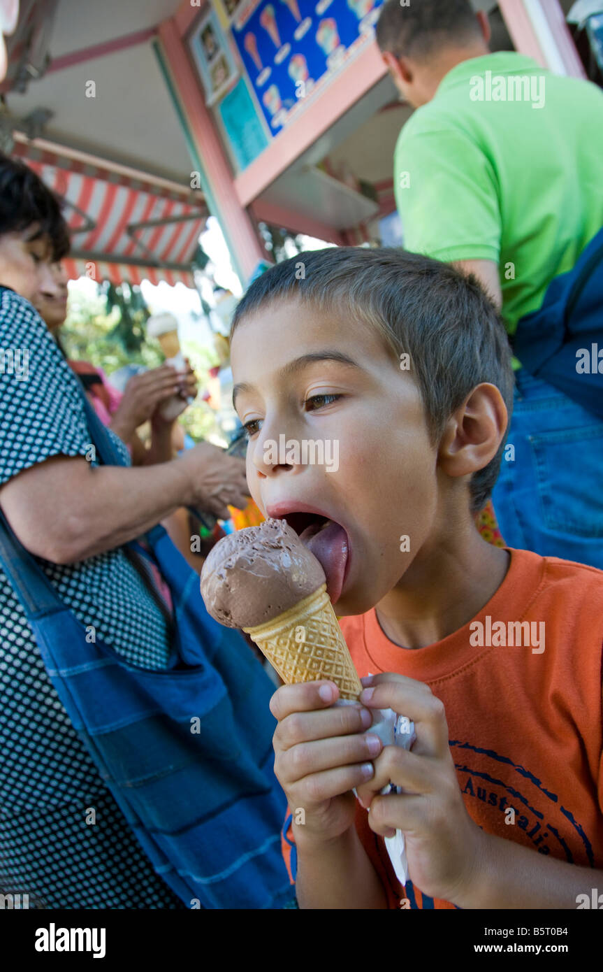 Boy licking ice cream cone hi-res stock photography and images - Alamy