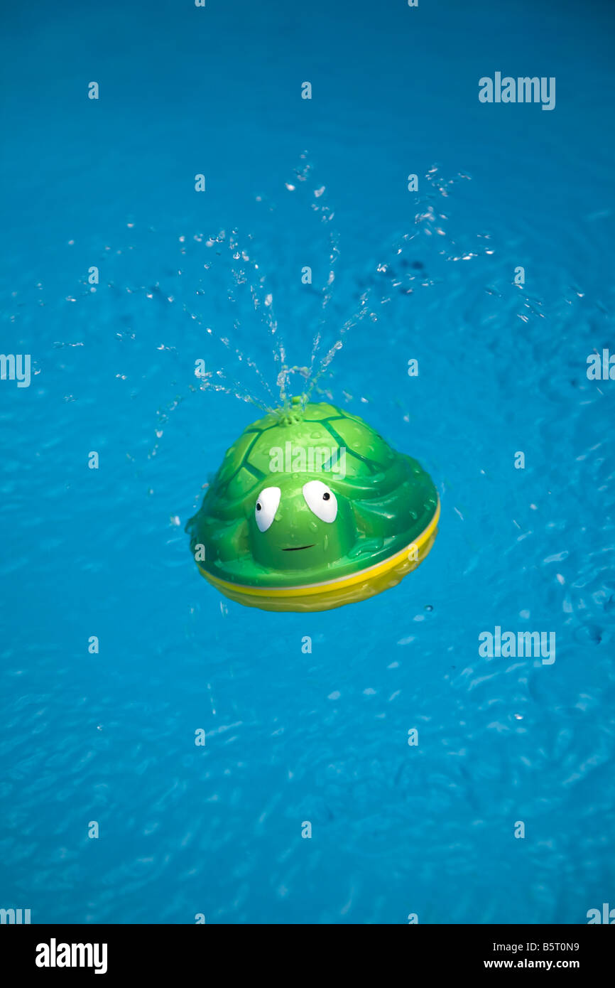Large paddling Pool Plastic electric turtle spraying water Stock Photo ...