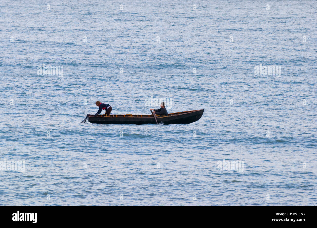 Fishing with nets from a currach inshore during the Herring Festival in ...