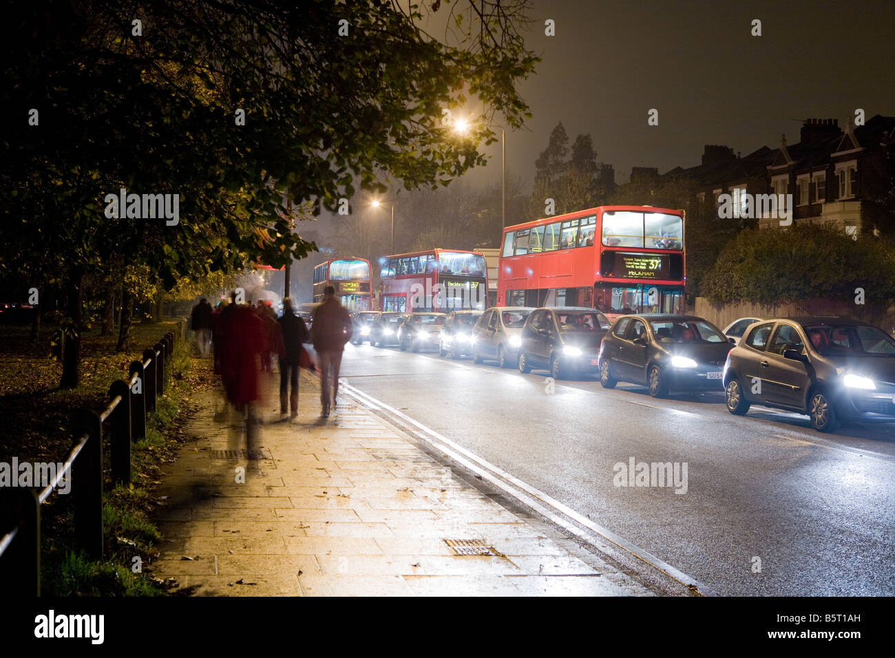 People Walking Home On A Cold Wet Evening Clapham Common London UK ...