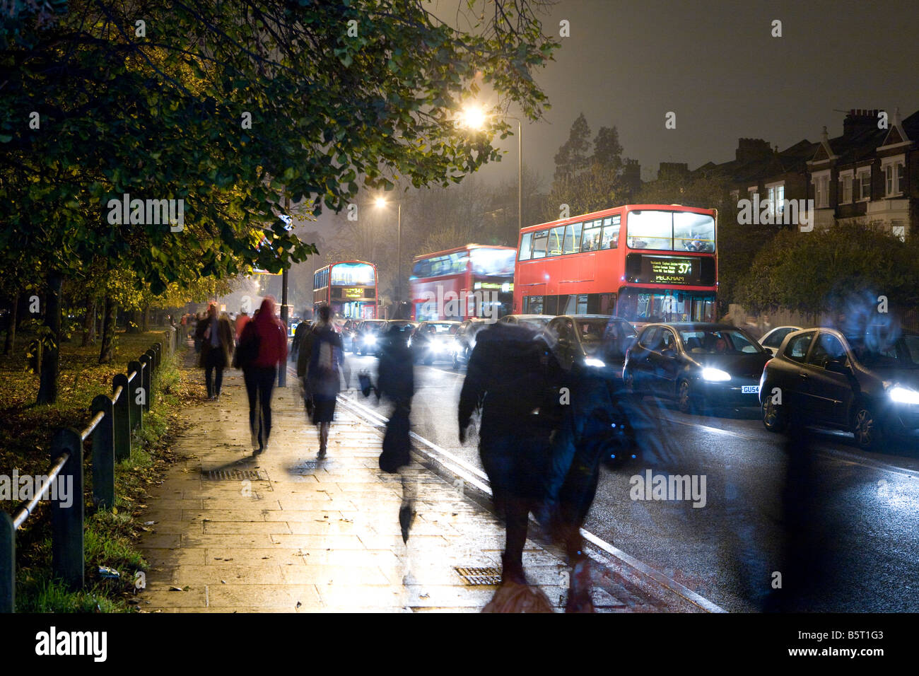People Walking Home On A Cold Wet Evening Clapham Common London UK ...