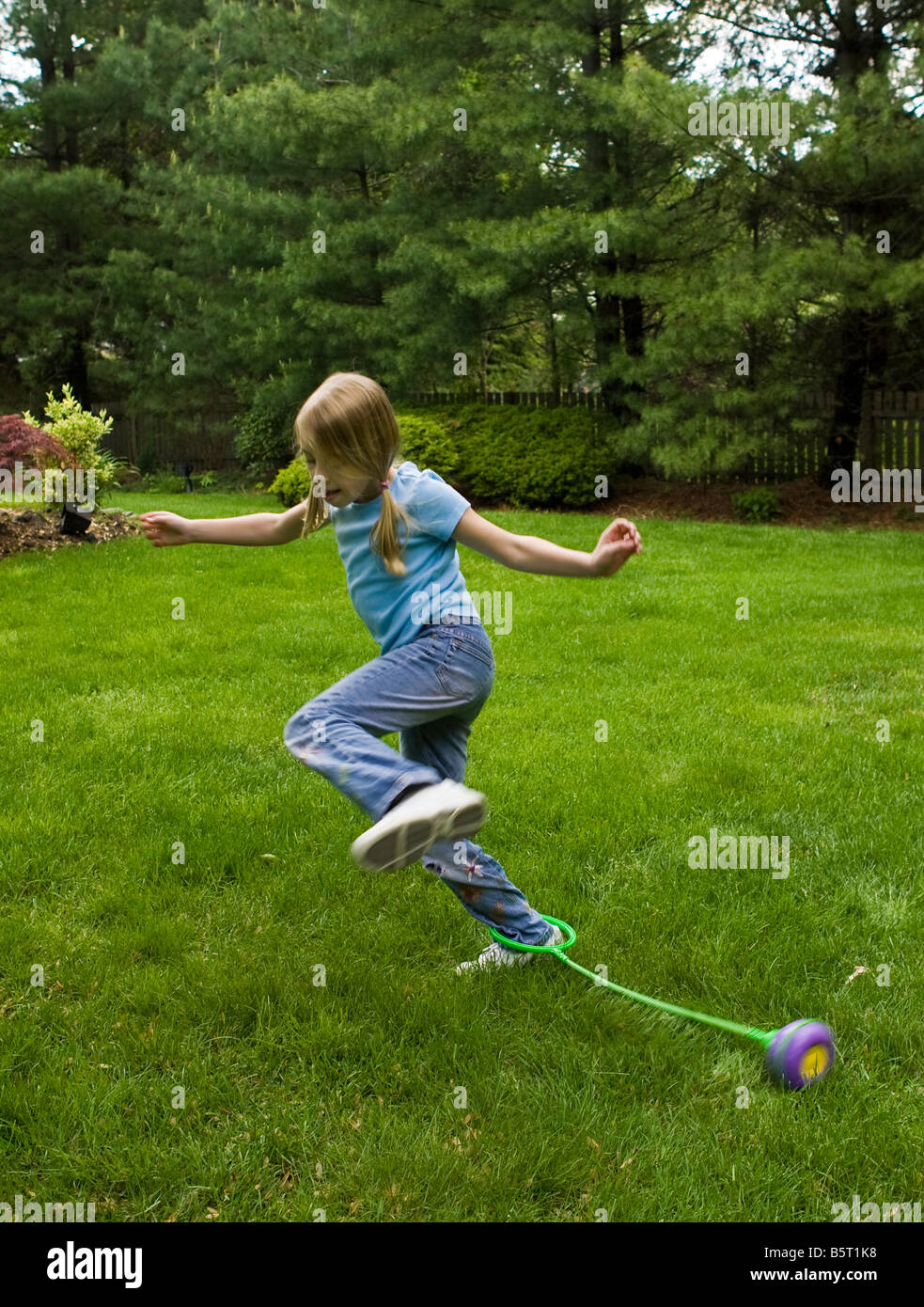 Child playing a jumping game Stock Photo - Alamy