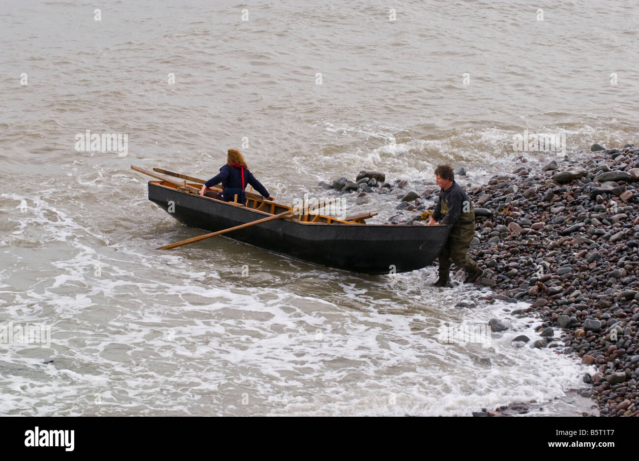 Fishing with nets from a currach inshore during the Herring Festival in ...