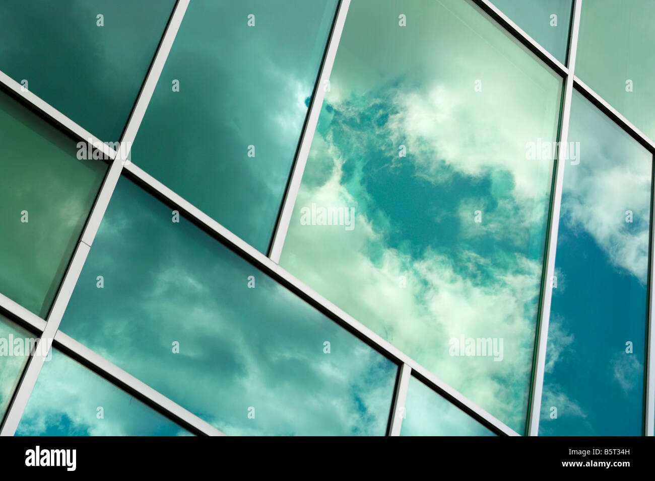 cloudy sky on a building windows Stock Photo - Alamy