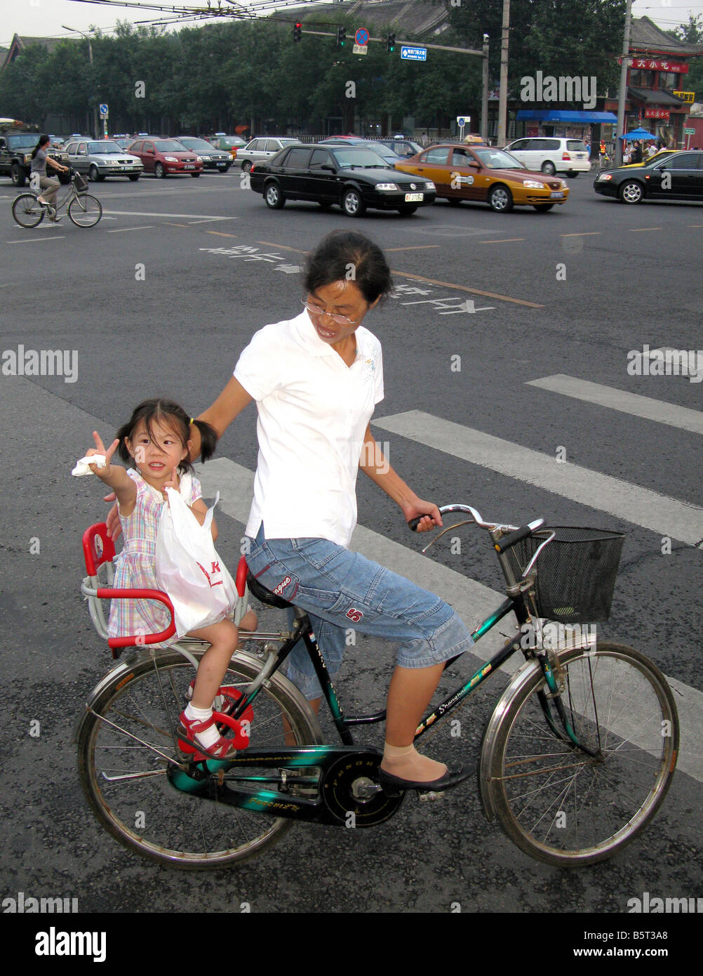 Girl riding bike china hi-res stock photography and images - Alamy