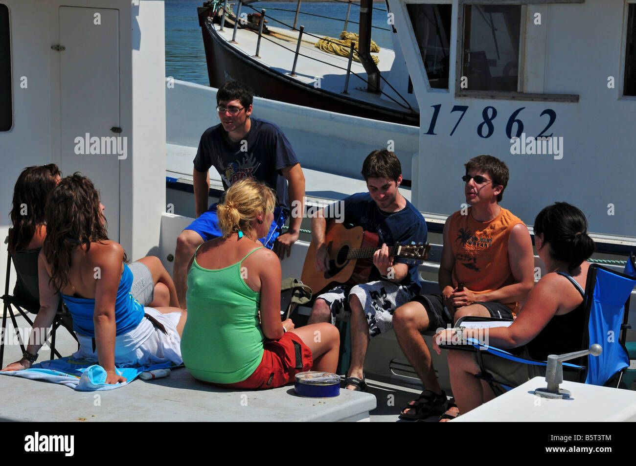 Young Quebecers on a boat Iles de la Madeleine Quebec Canada Stock ...