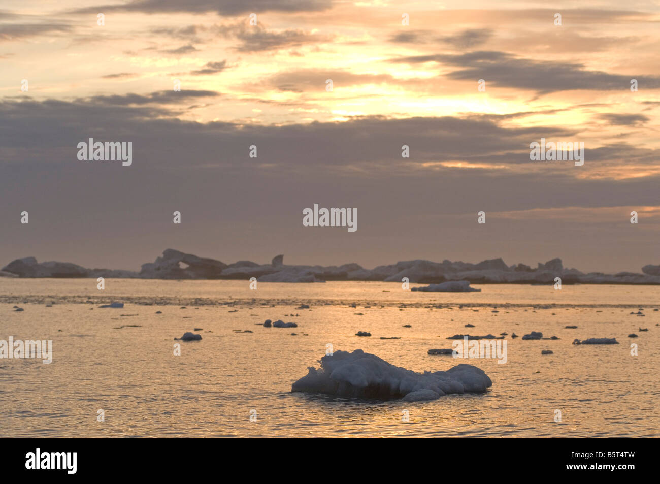 melting shorefast ice in the Beaufort Sea at sunset Arctic Ocean off ...