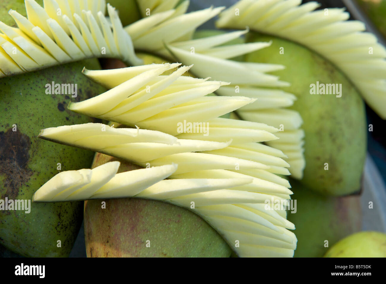 Mango cut for display on a food cart in India Stock Photo - Alamy