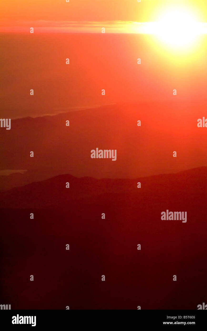 powerful dramatic sunset sunrise in mountains red orange yellow sun ...