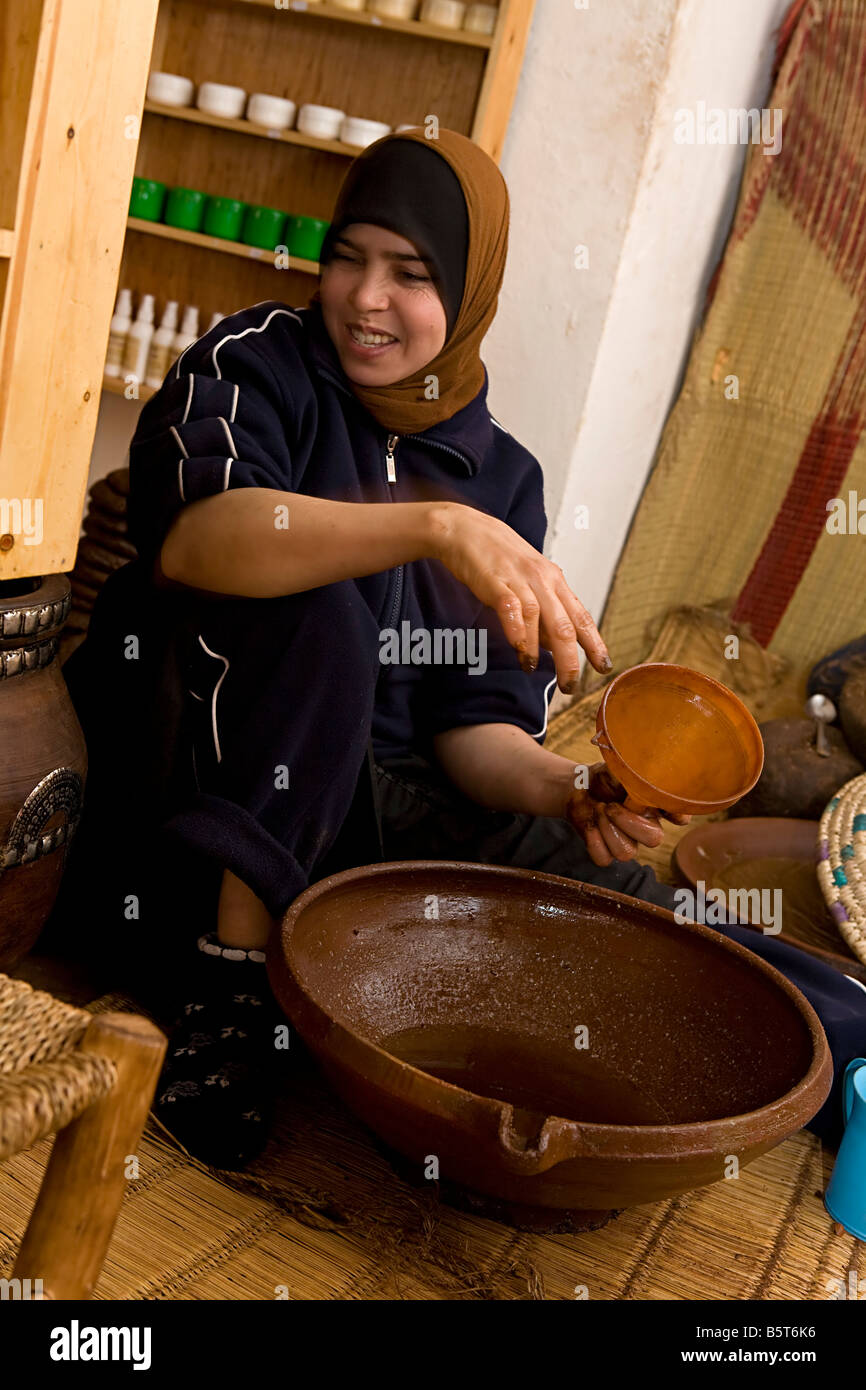 Girls refining Argan oil from the Argania Spinosa ( Argan Tree ) in the ...