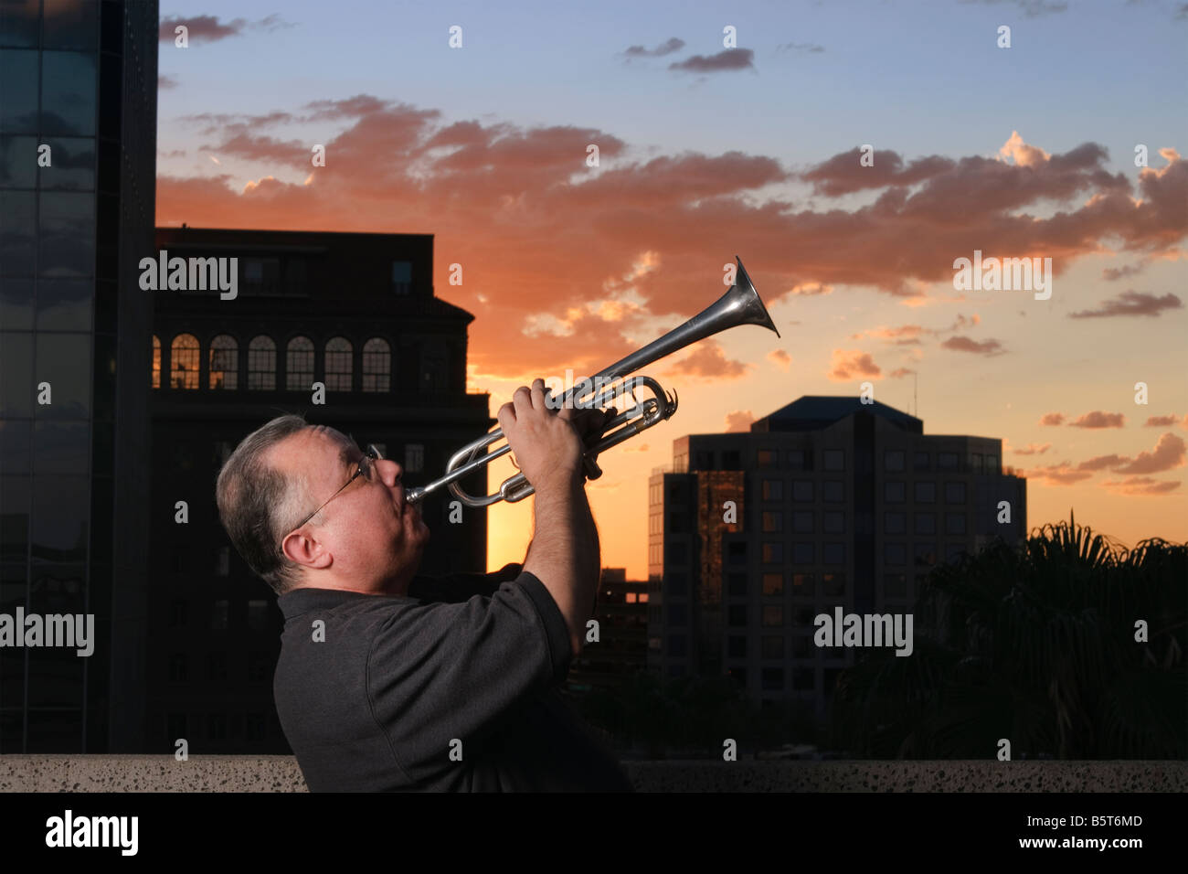 A trumpeter plays over the roofs of downtown Phoenix, Arizona, with a ...