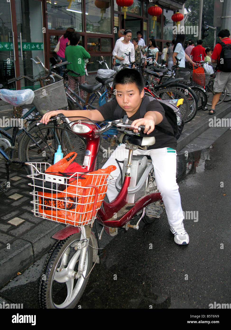 A boy on a bike in Beijing, China Stock Photo - Alamy