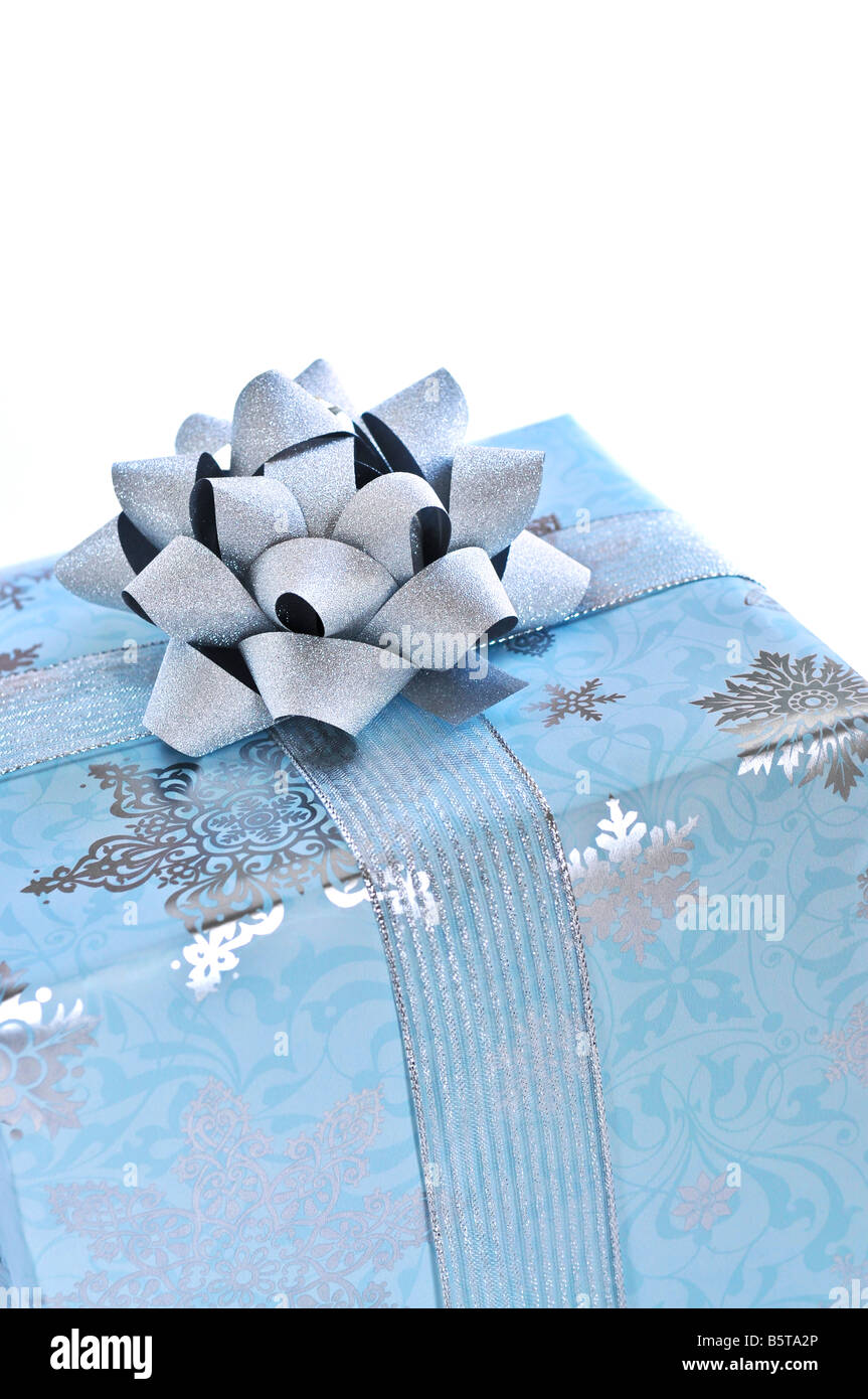 Wrapped christmas gift box close up on white background Stock Photo - Alamy