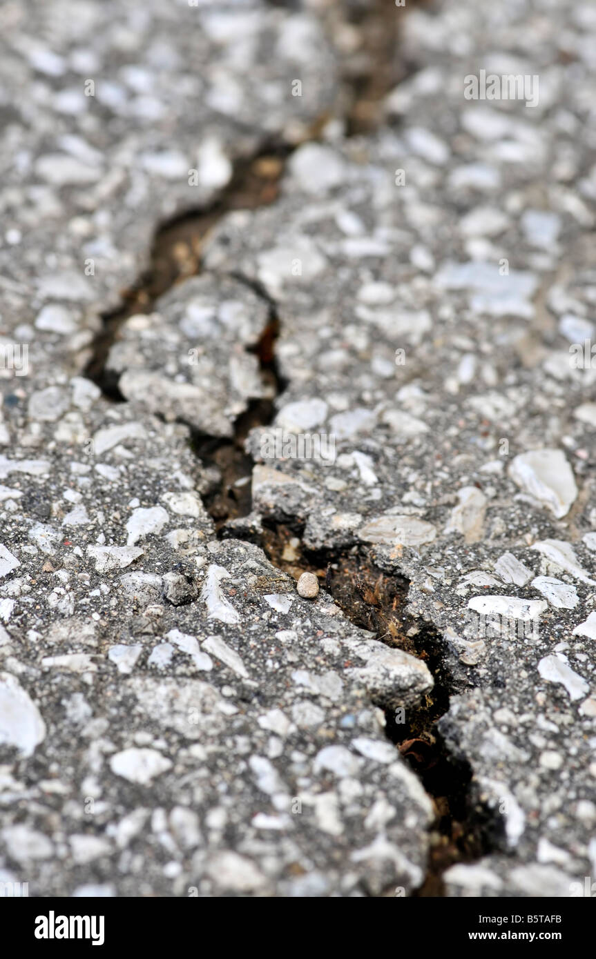 Crack in old asphalt pavement close up Stock Photo - Alamy