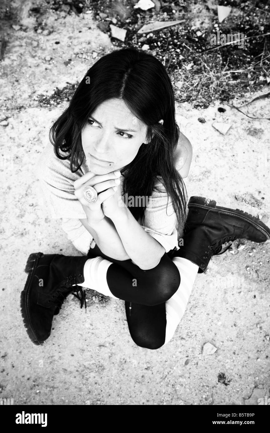 Young woman begging with sad expression in her face Stock Photo - Alamy