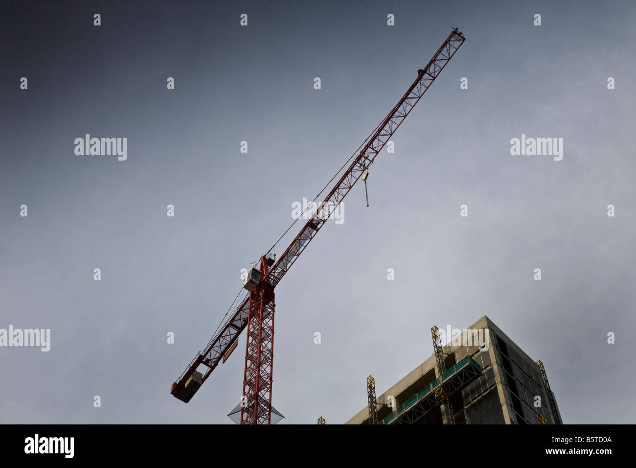 Building crane over a tower block site Stock Photo - Alamy