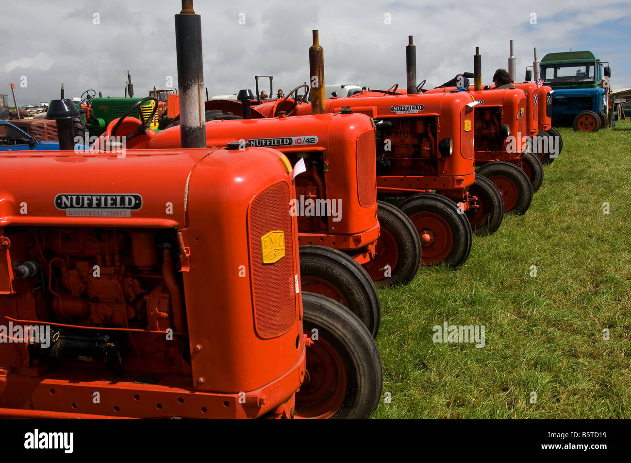 A line of Red Nuffield Vintage Tractors Stock Photo - Alamy