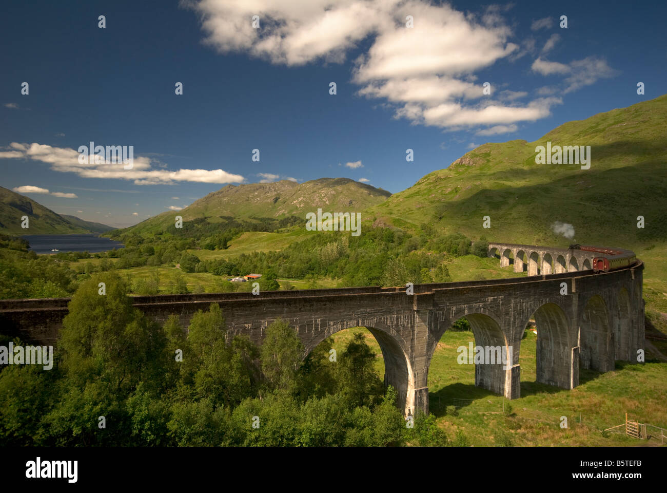 The Jacobite steam train crossing over the Glenfinnan viaduct, Scotland ...