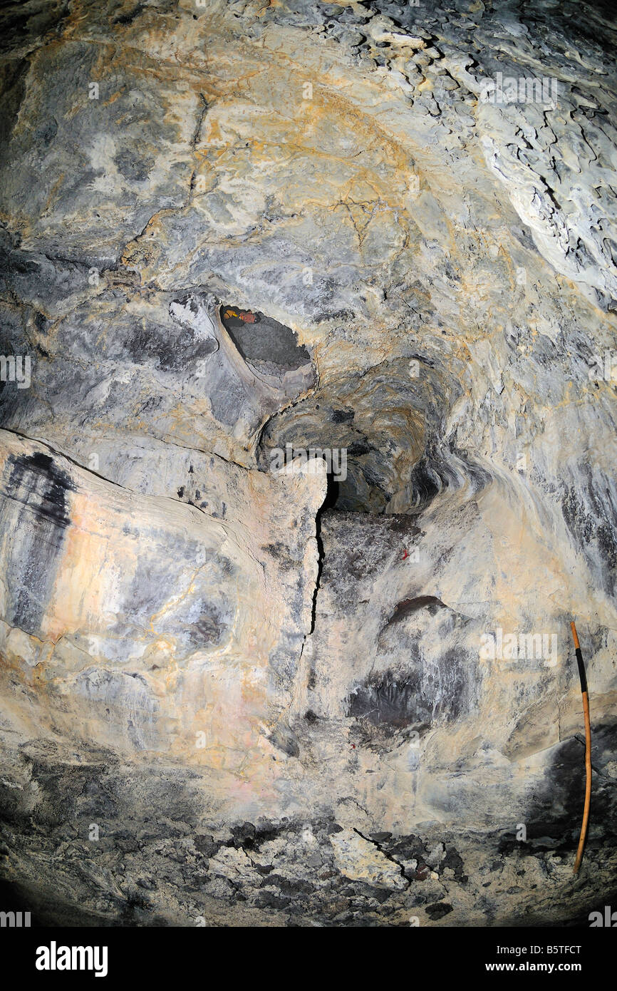 Hiker in one of the large lava tubes from the Hualalai volcano 1801 ...