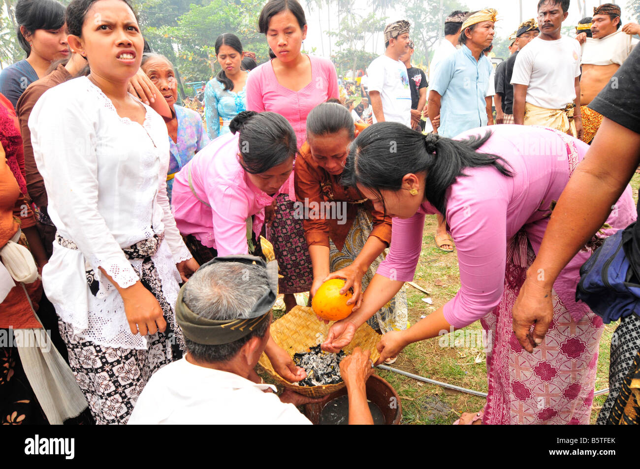 Relatives helps picking up ash from burning the dead body at cremation ...