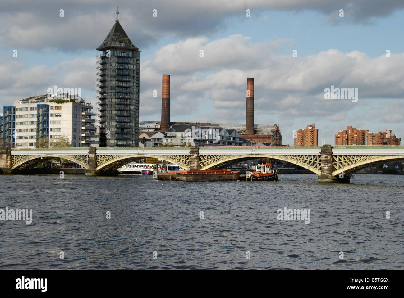 Battersea Reach Railway Bridge with Chelsea Harbour in the distance ...