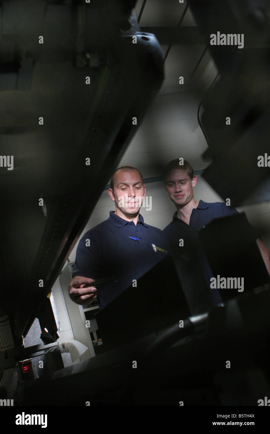 modern apprentice at work with mentor on a CAD machine Stock Photo - Alamy