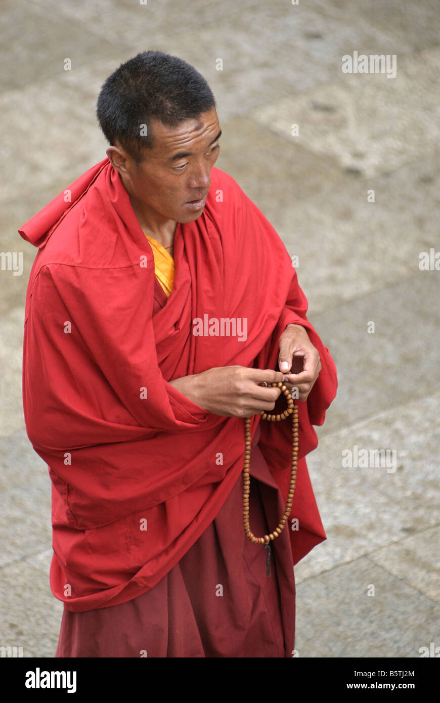 Monk holding beads hi-res stock photography and images - Alamy