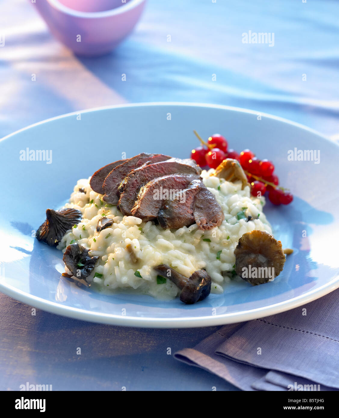liver and creamy risotto Stock Photo - Alamy