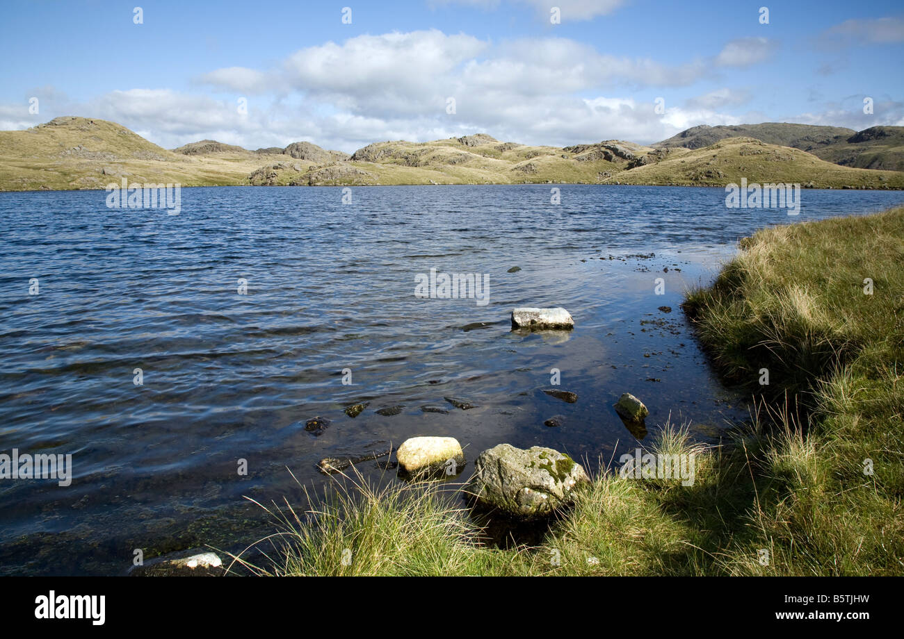 "Seathwaite Fell" and the deep blue waters of "Sprinkling Tarn Stock ...
