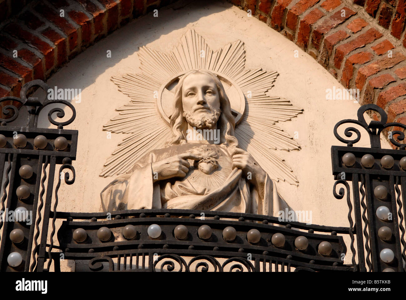 Statue of Christ with aura and his hand on his heart Stock Photo - Alamy