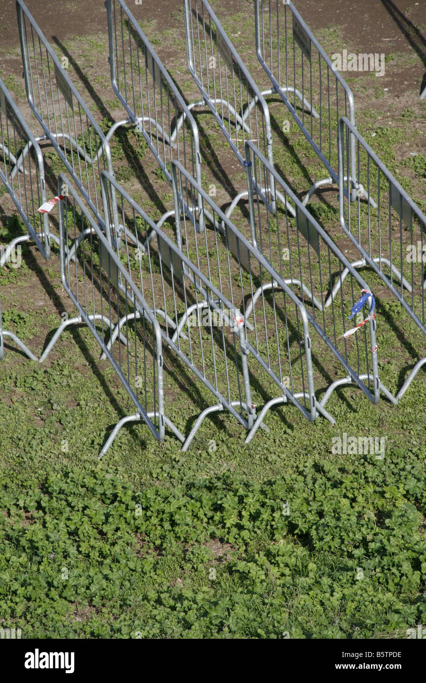 rows of many metal crowd control barriers gates in field Stock Photo ...
