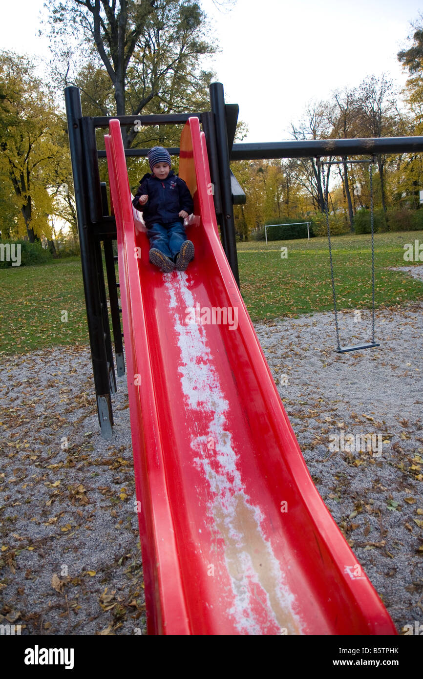little boy on slide Stock Photo - Alamy