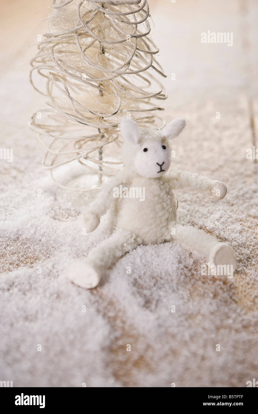 White Christmas Tree with toy sheep in snow Stock Photo - Alamy
